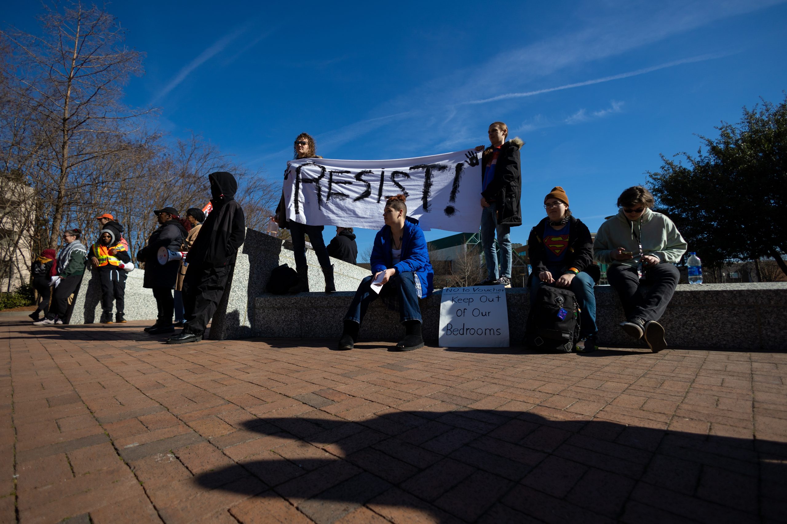 Triad City Beat | GALLERY: Dozens march in Greensboro to protest Trump ...